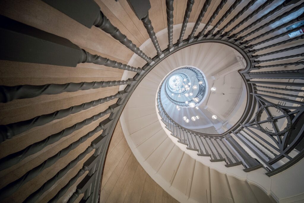 Cecil Brewer designed spiral staircase at Heals of London. - La Vie Zine